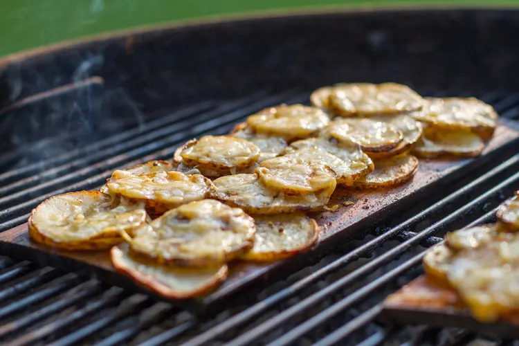 Planked Garlic & Parmesan Potato Chips | Grilling Inspiration | Weber ...